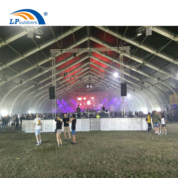 Curved style temporary stadium tent for concert or sports court